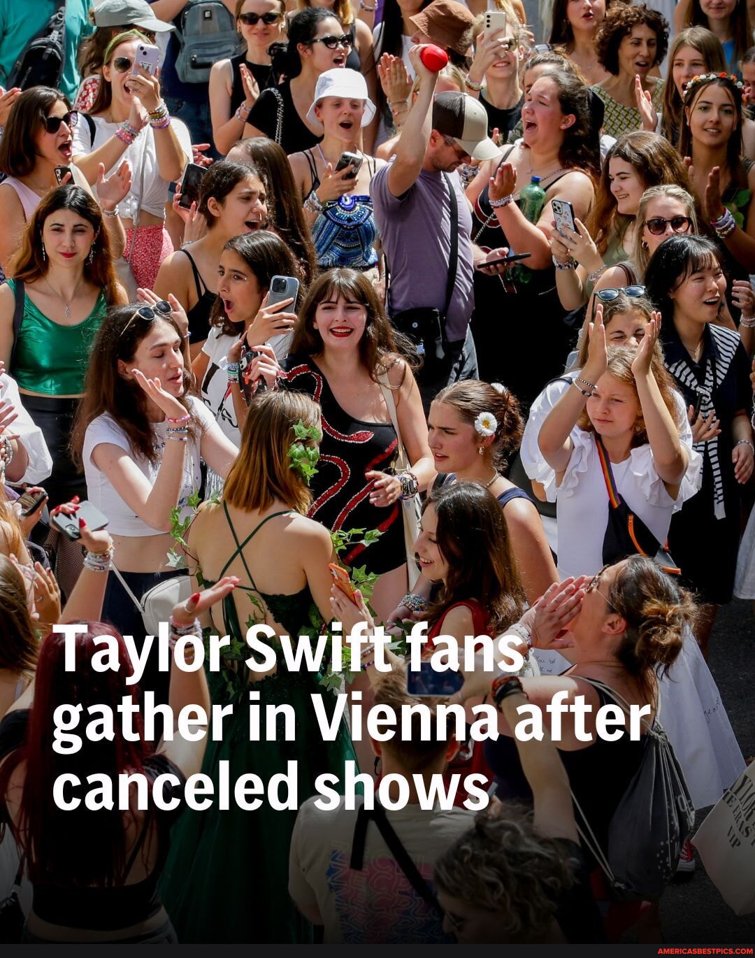 Police kept a watchful eye as hundreds of Taylor Swift fans gathered and sang her songs in the ...
